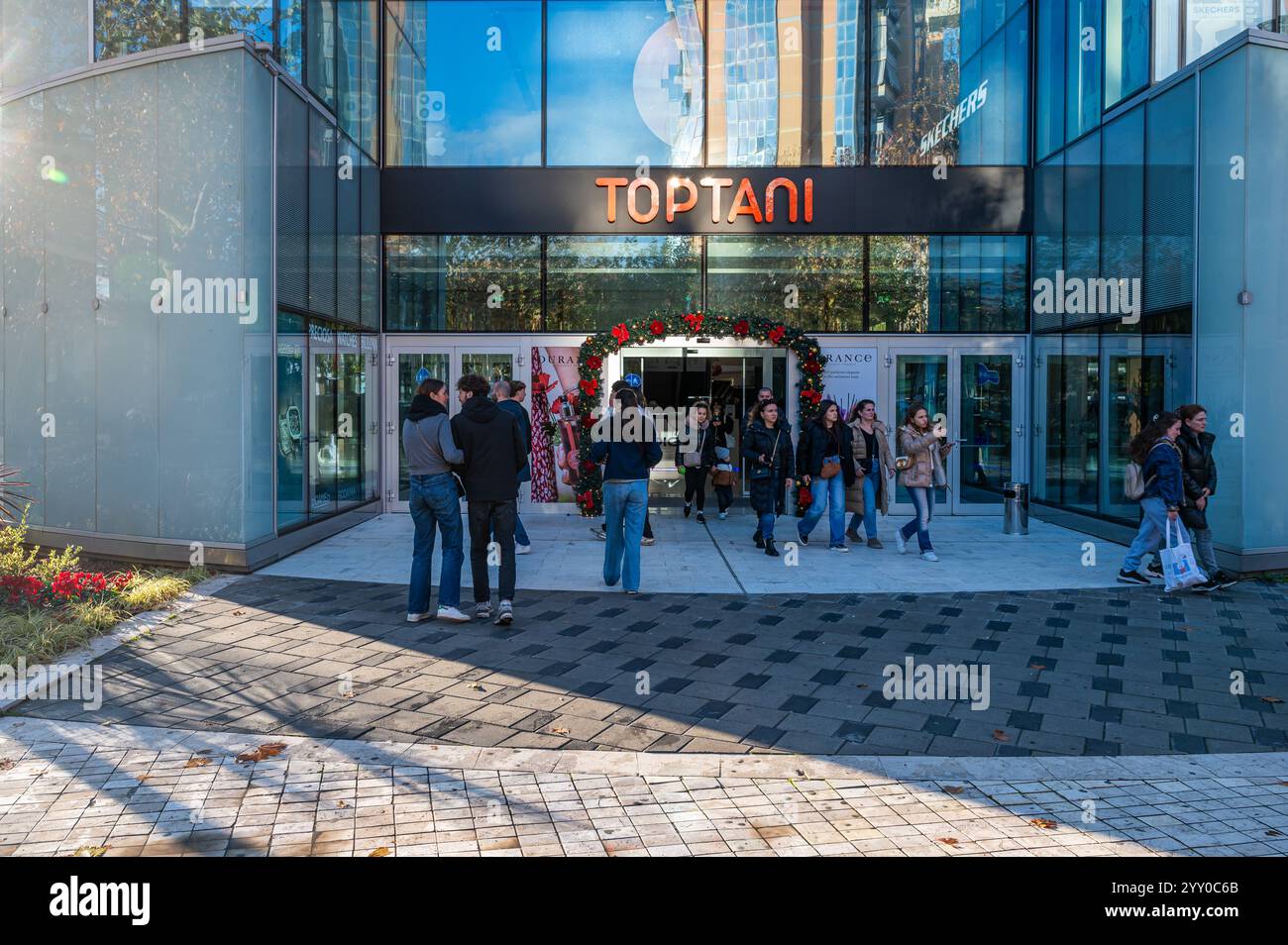 People walking at the park of the Toptani shopping center in Tirana ...