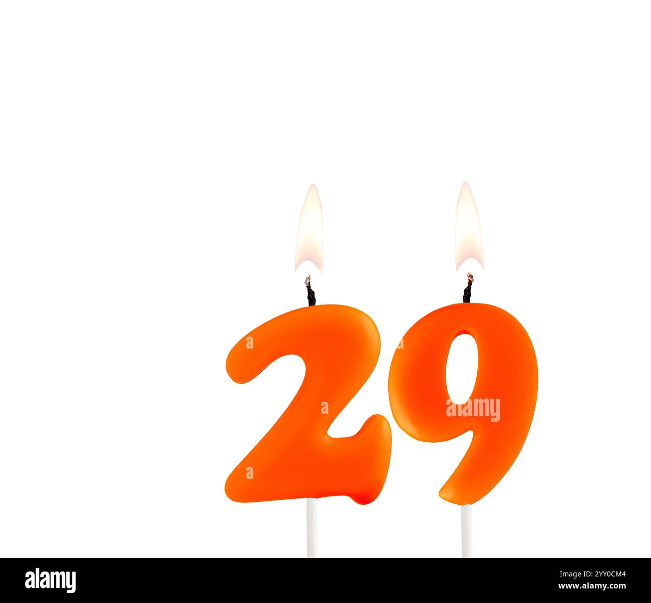 Lit birthday candle - Candle number 29 on white background Stock Photo ...