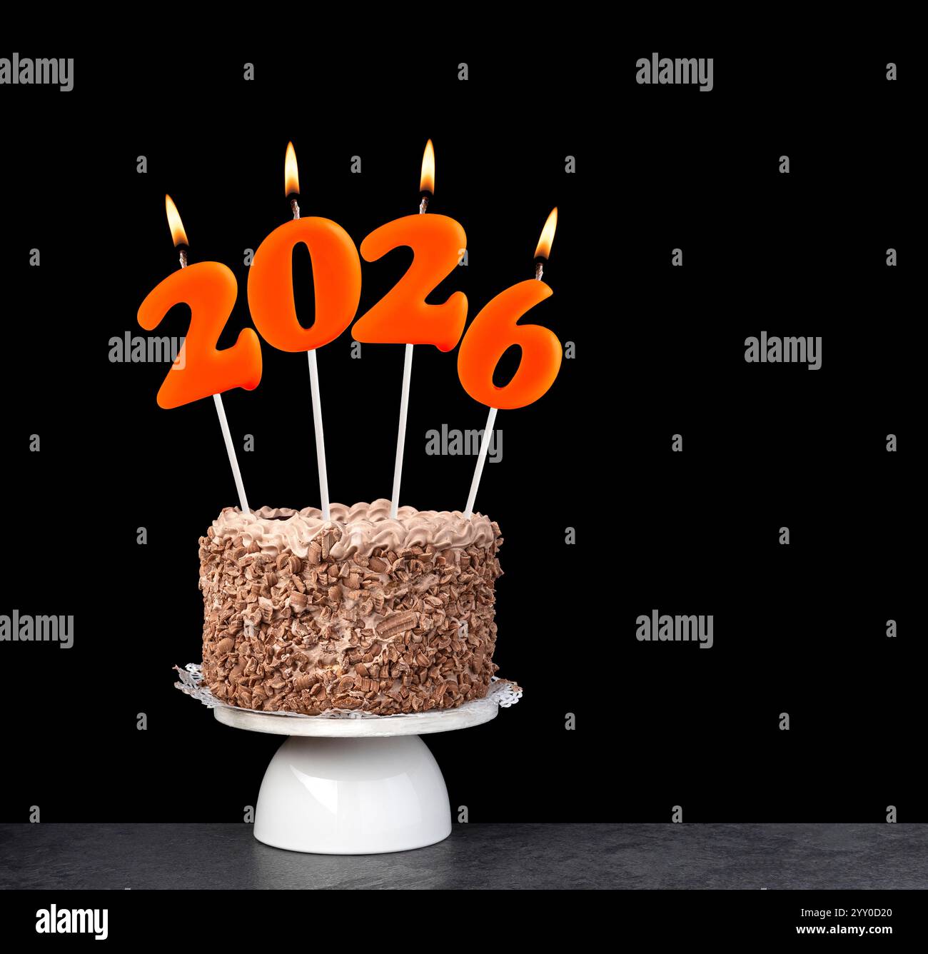 Cake with happy new year 2026 candles on black background Stock Photo ...