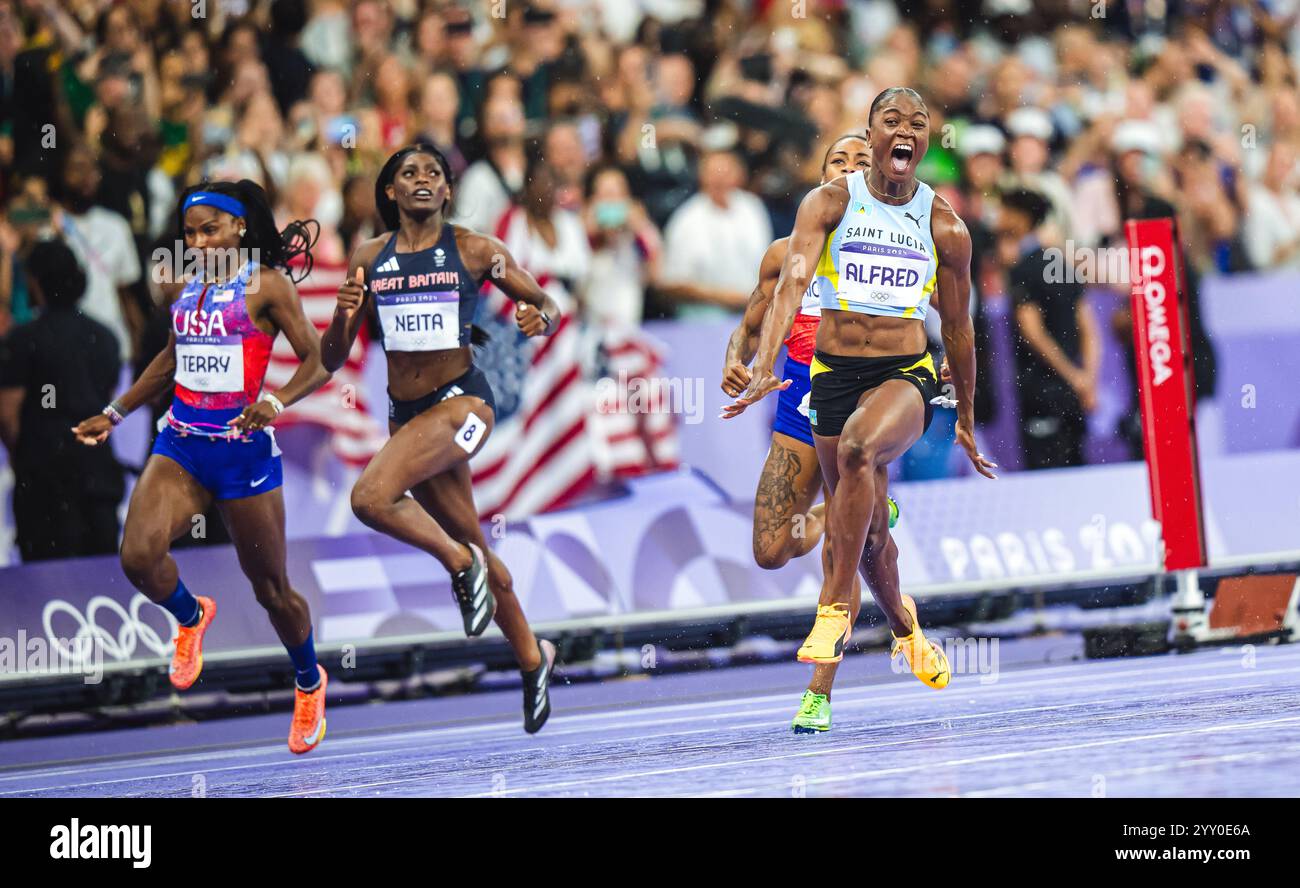 Julien Alfred winning in the 100 meters relay at the Paris 2024 Olympic ...