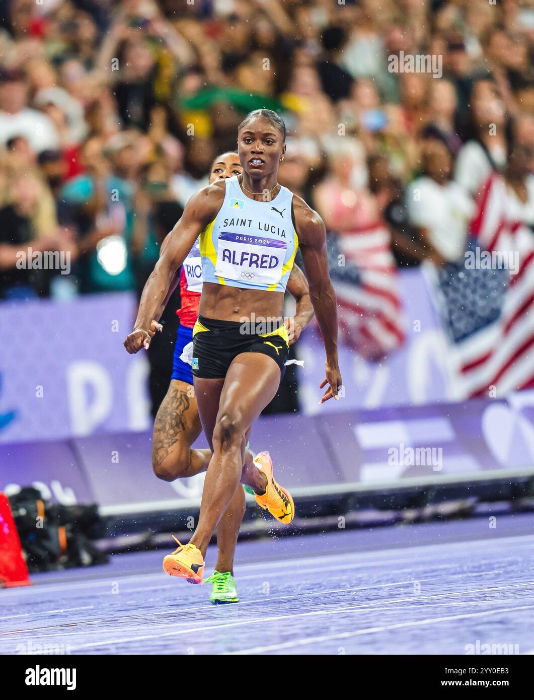 Julien Alfred winning in the 100 meters relay at the Paris 2024 Olympic ...