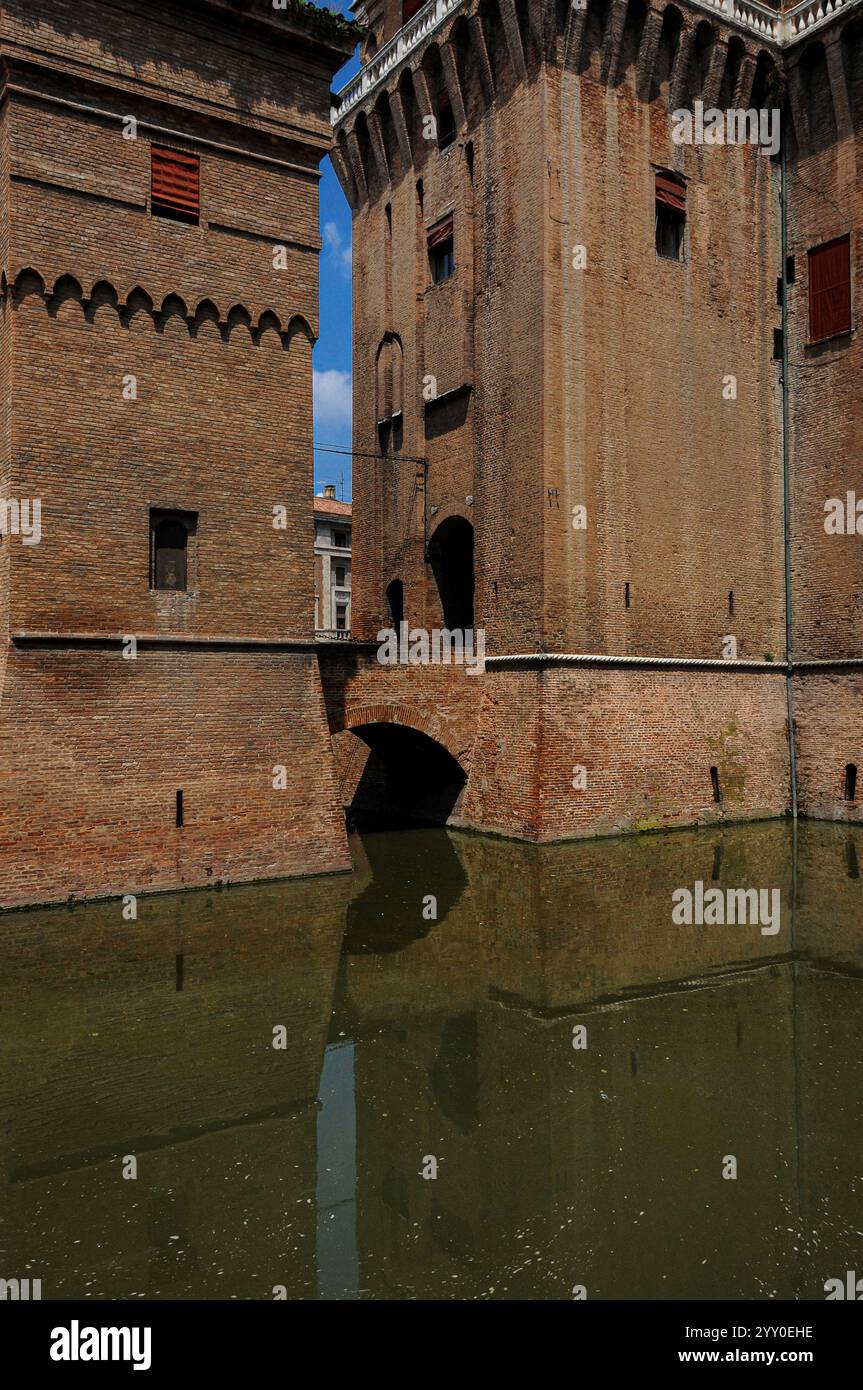 Defensive structure of terracotta bricks, the moated Castello Estense ...