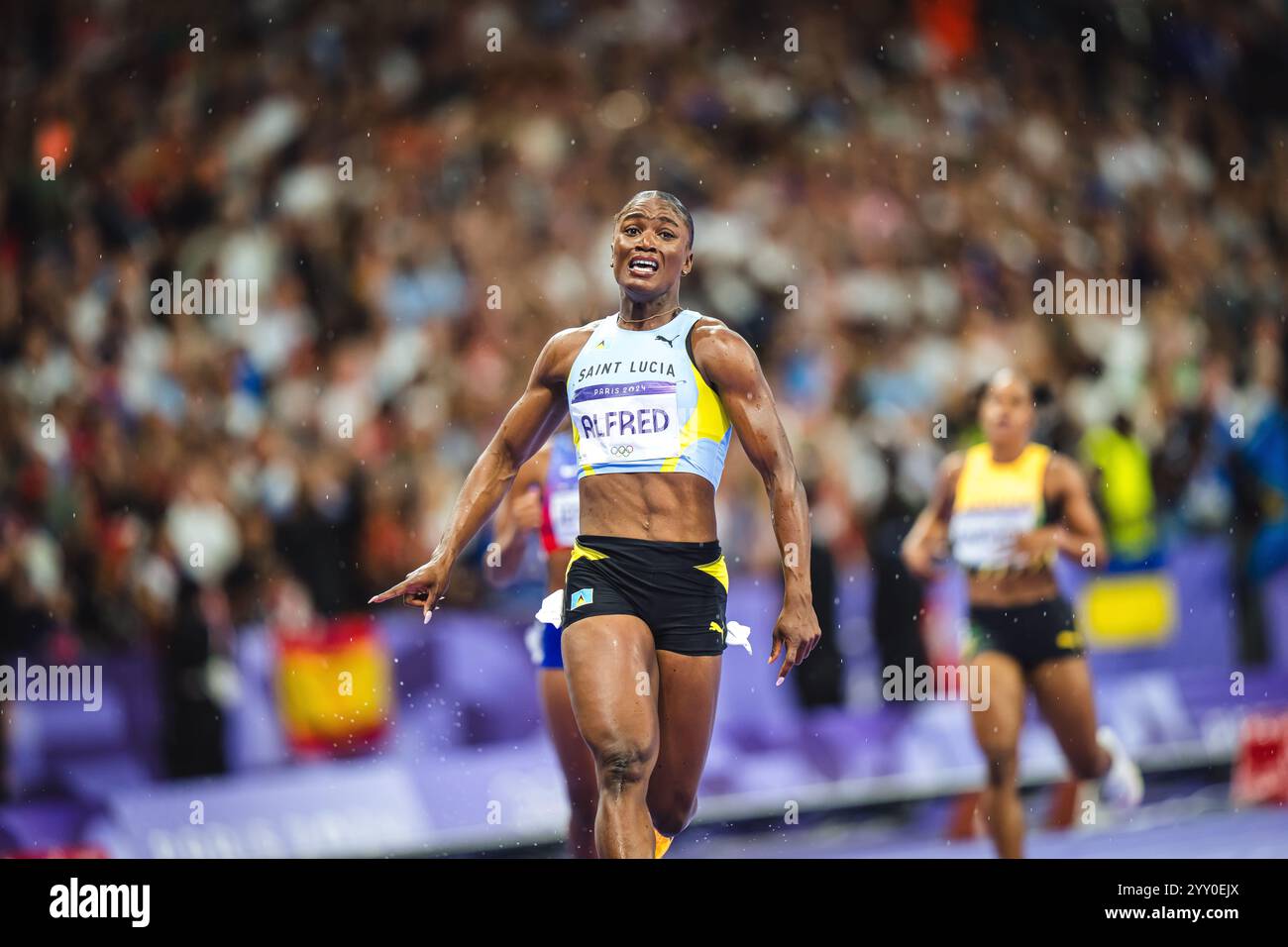Julien Alfred winning in the 100 meters relay at the Paris 2024 Olympic ...