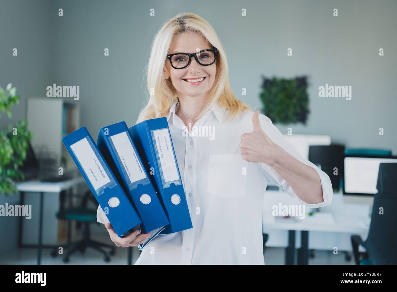 Photo of experienced bookkeeper lady wearing formal white shirt and ...