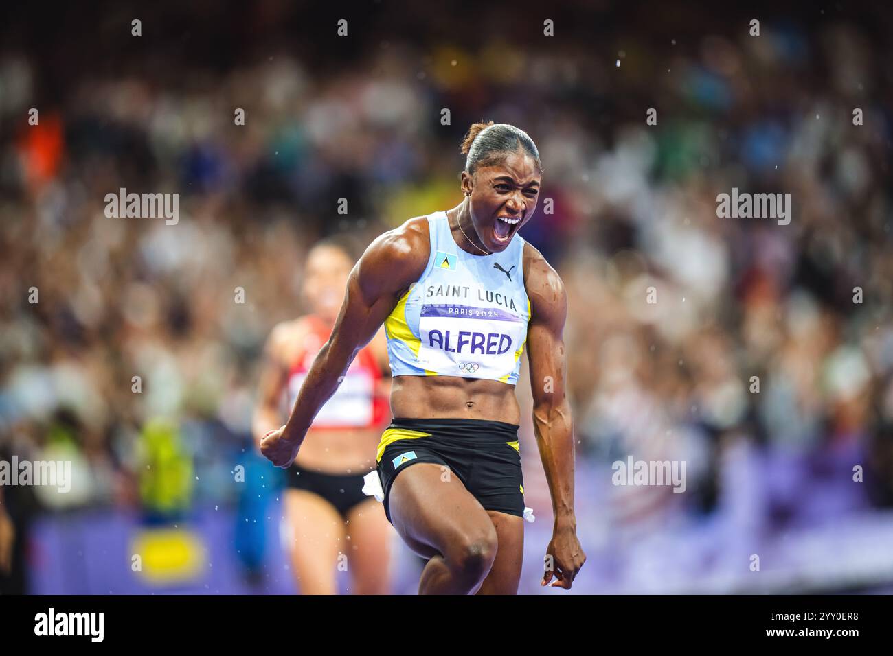 Julien Alfred winning in the 100 meters relay at the Paris 2024 Olympic ...