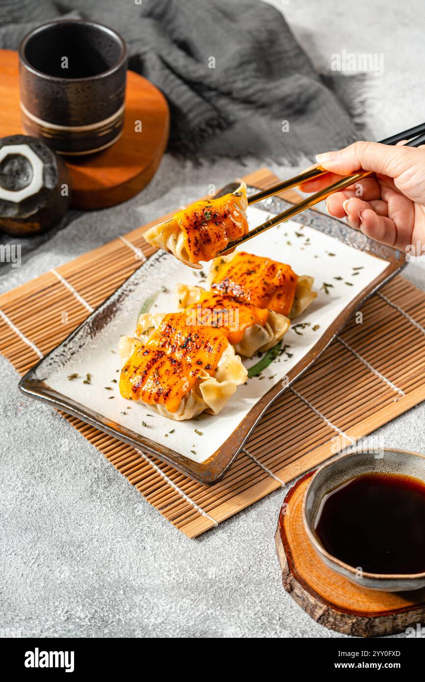 Grilled gyoza japanese dumplings foods with mentai sauce Stock Photo ...