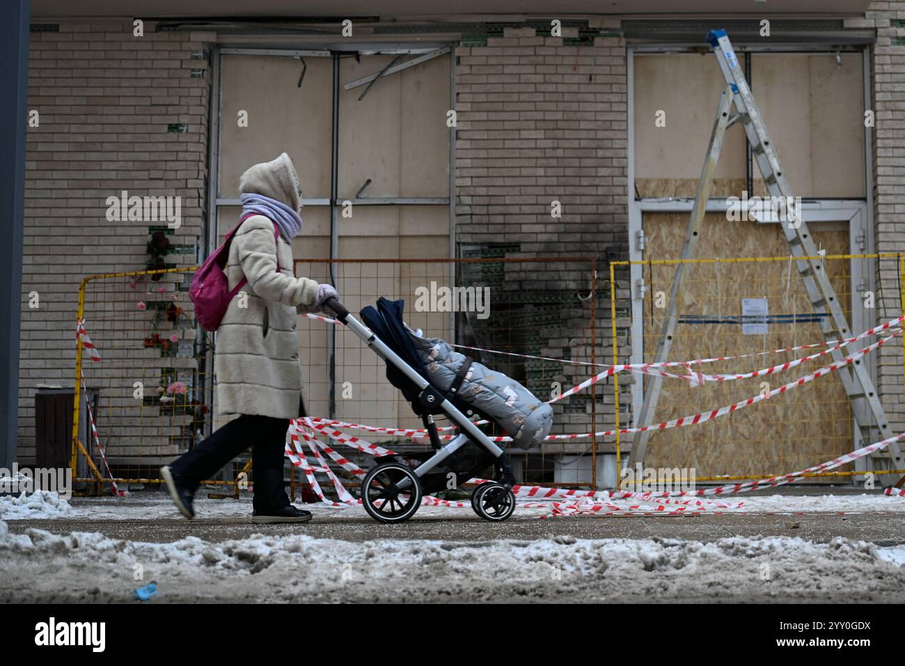 A person walks past an apartment block in Moscow, Russia, Wednesday ...