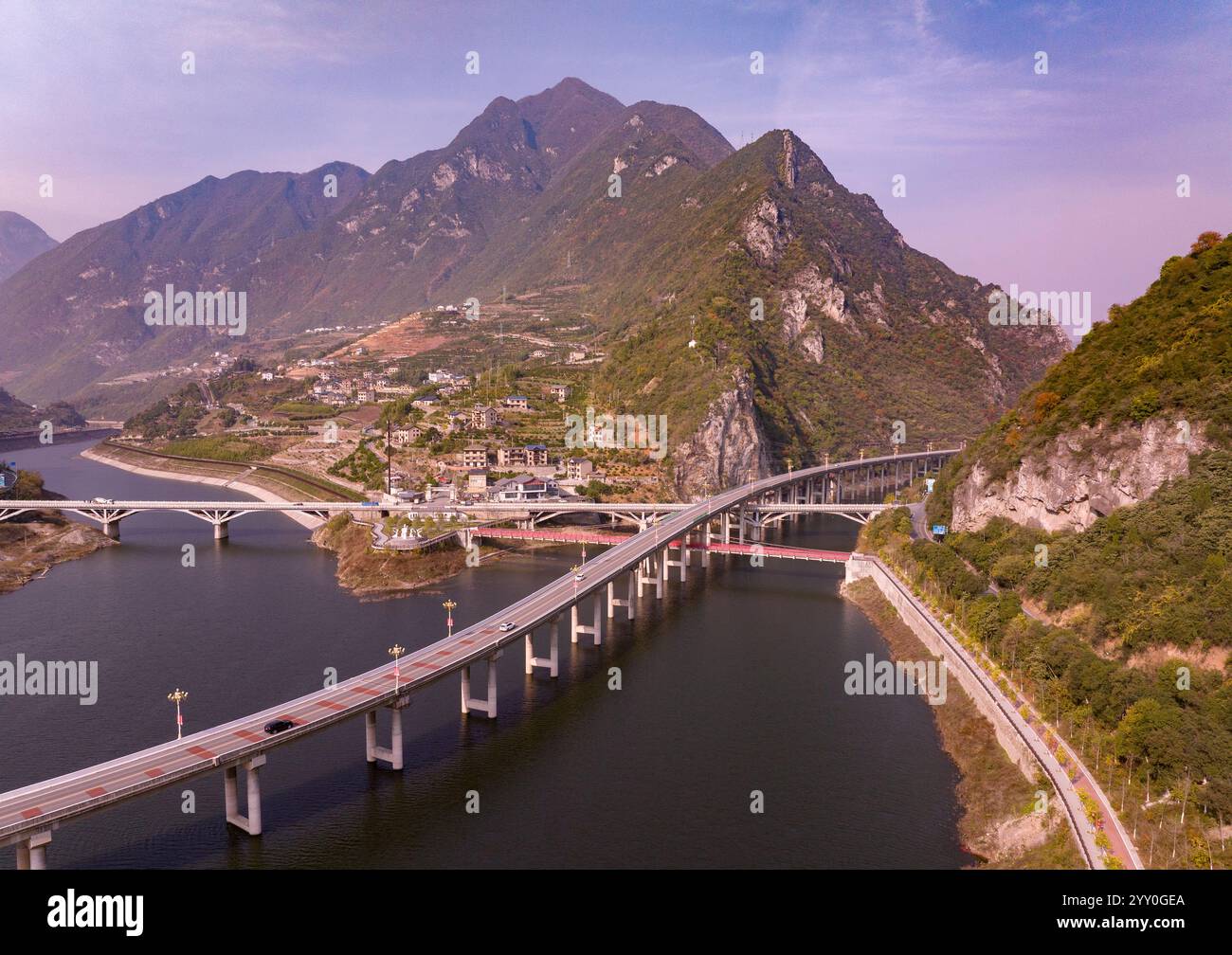 Yichang, China. 18th Dec, 2024. Vehicles drive on the Guzhao water ...