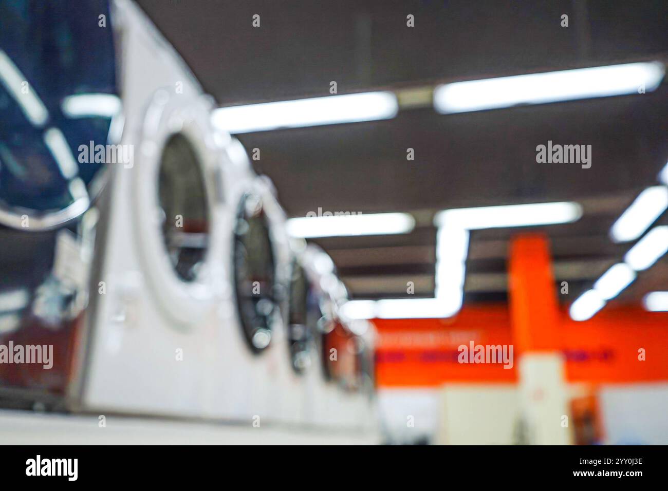 Retail aisle with blurred washing machines Stock Photo - Alamy