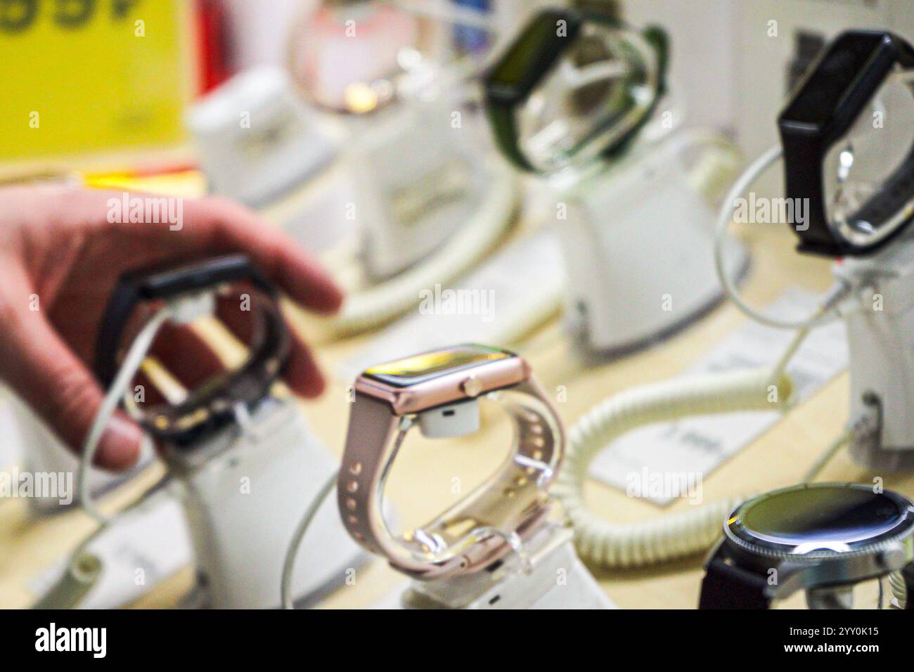 Customer picking up a smartwatch in a store Stock Photo - Alamy