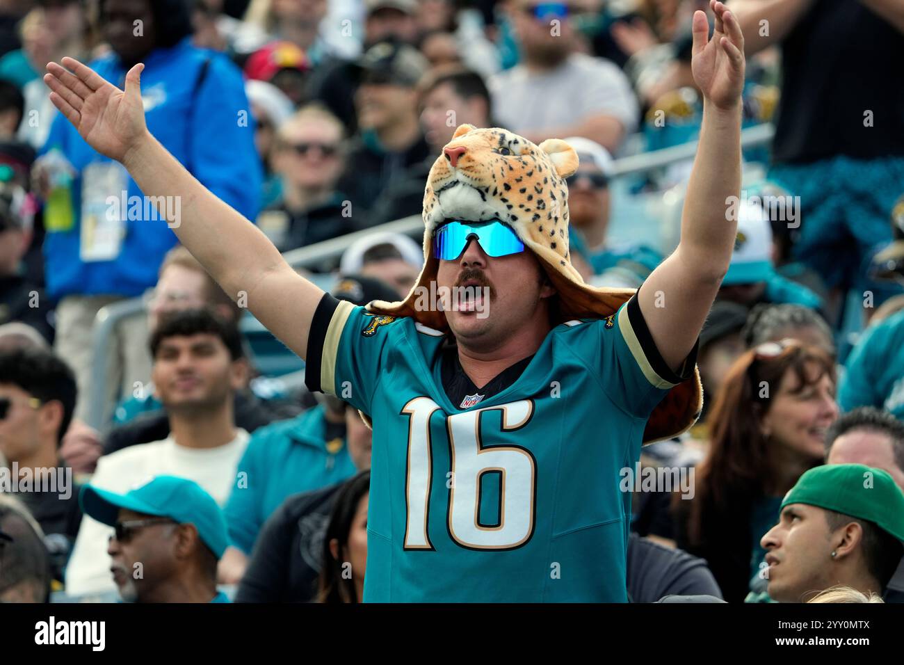 A Jacksonville Jaguars fan cheers during the first half of an NFL ...