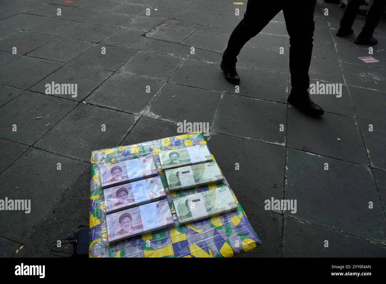 Iranian banknotes are displayed by a street money exchanger at Ferdowsi ...