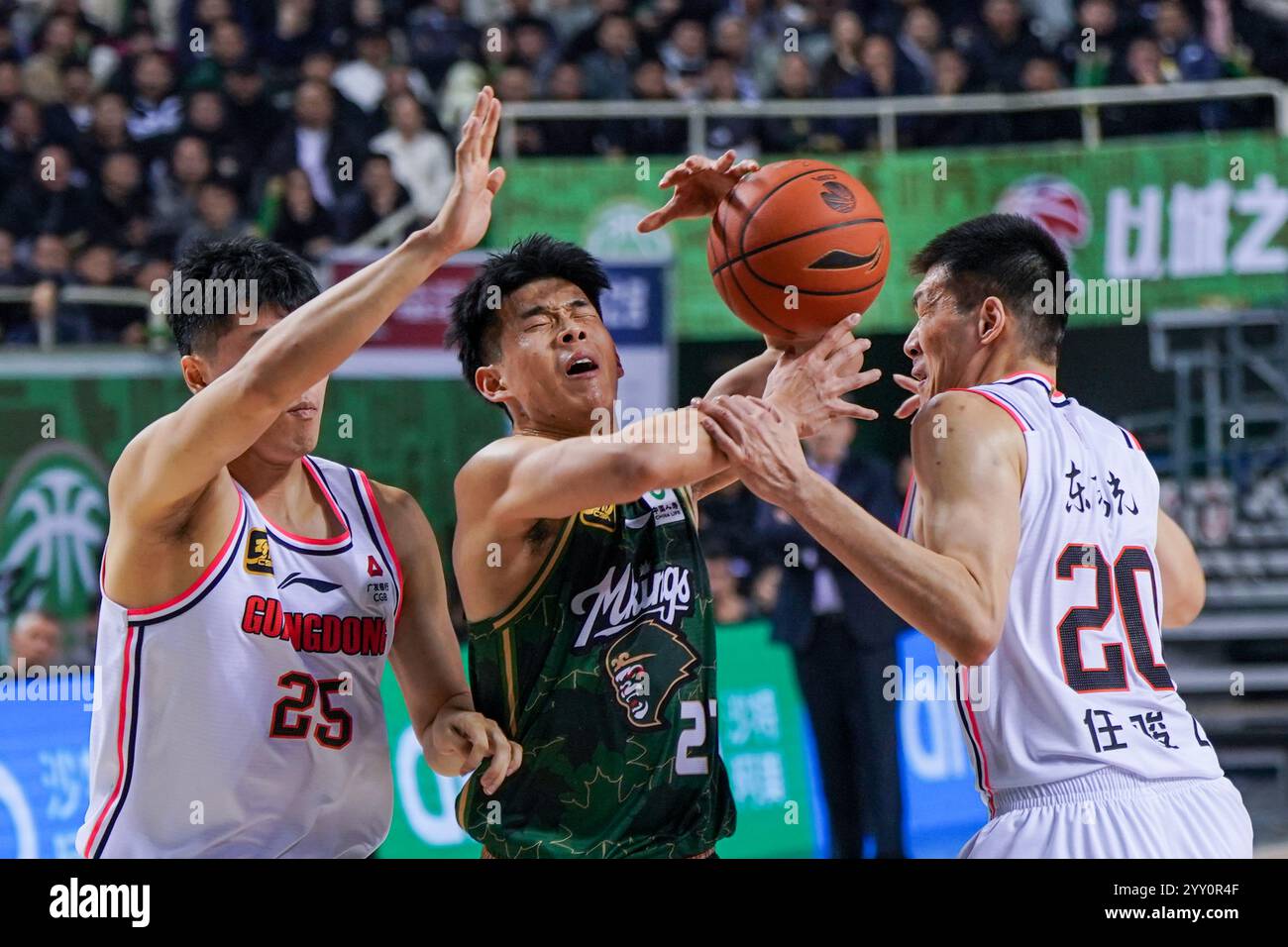 Nanjing, China's Jiangsu Province. 18th Dec, 2024. Lin Wei (C) of Nanjing Monkey Kings breaks ...