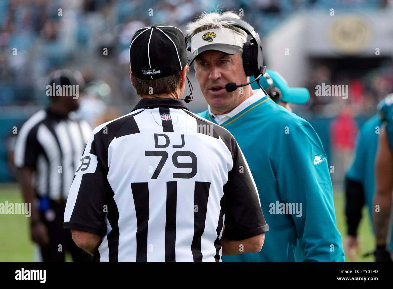 Down judge Kent Payne (79) has a discussion with Jacksonville Jaguars ...