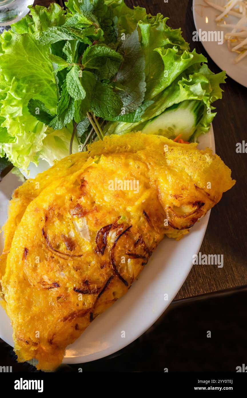 Vietnamese Banh Xeo Crispy Pancake with Fresh Herbs and Lettuce Stock ...