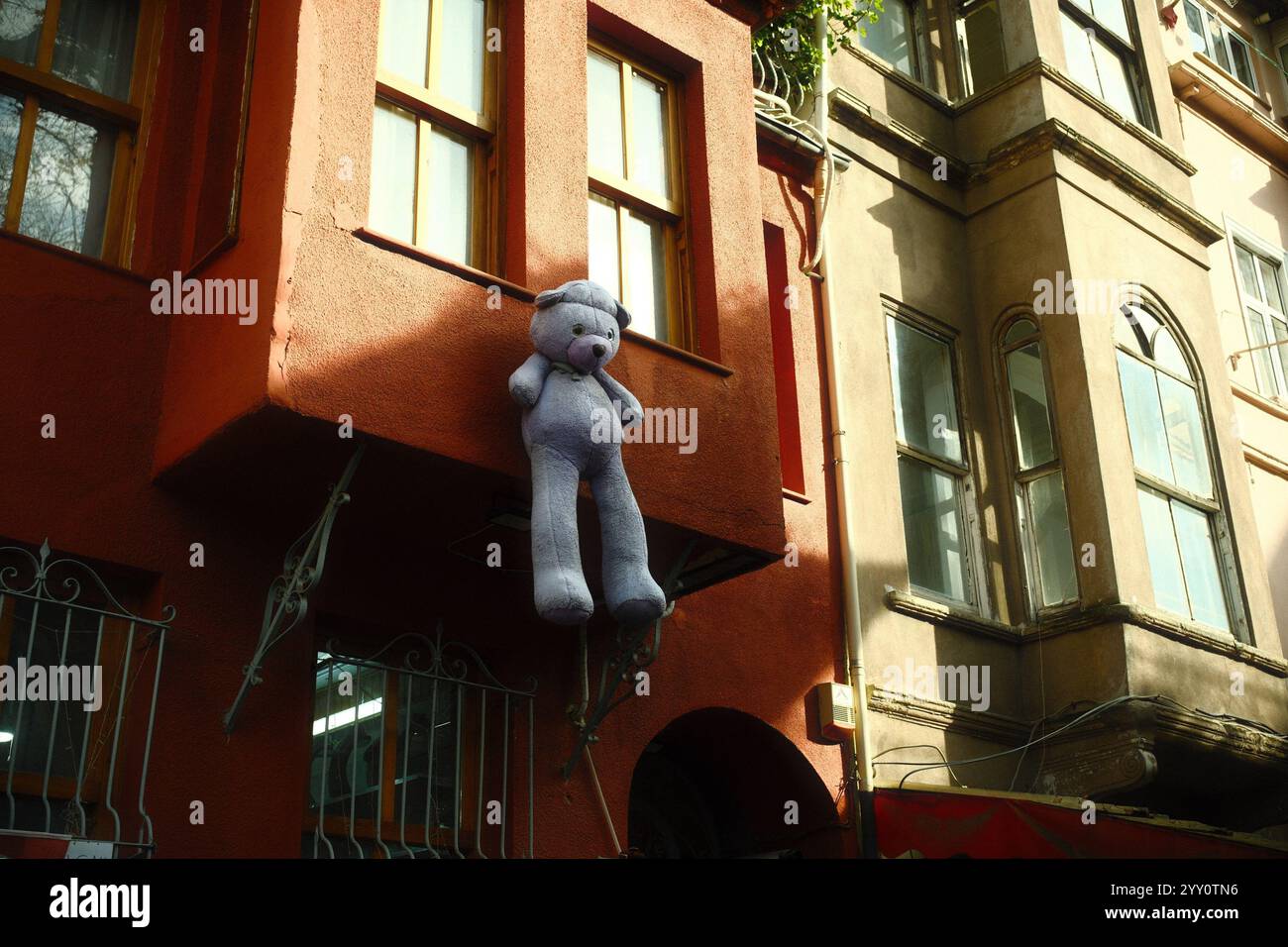 Balat, Istanbul, turkiye :A large teddy bear is hanging outside a ...
