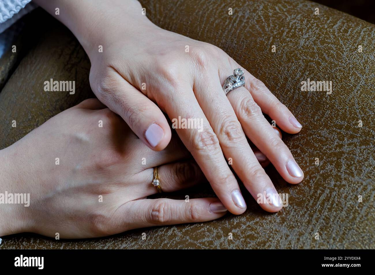 bridge and groom holding hands together show the wedding rings Stock ...