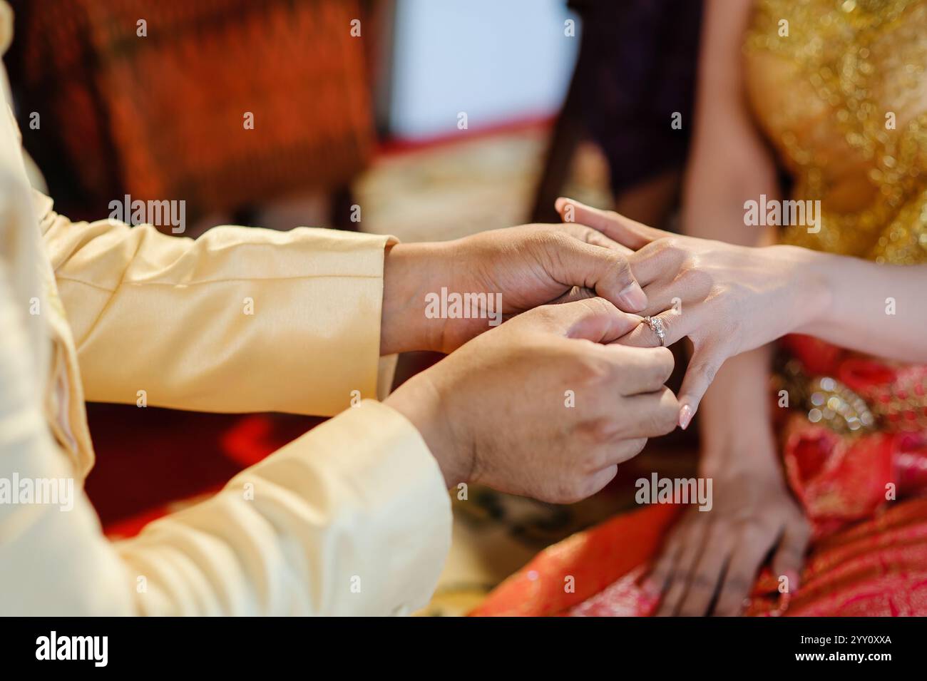 wedding rings together in hands Stock Photo - Alamy