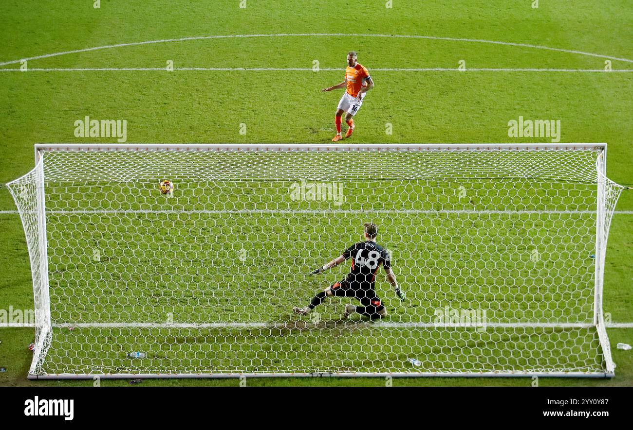 Blackpool's Jordan Rhodes (top) scores in the penalty shoot-out during ...