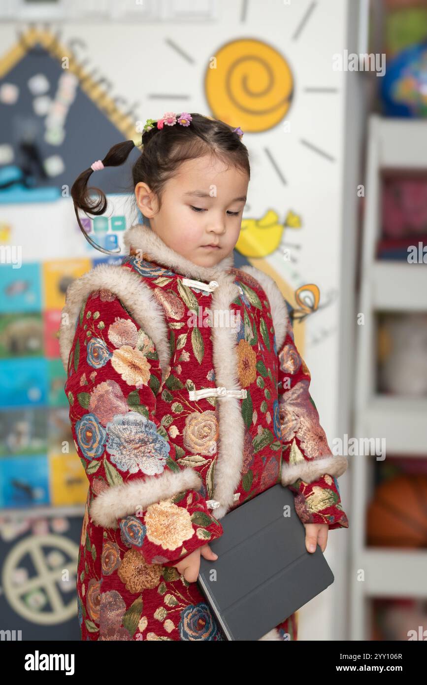 Cute multiracial girl is ready for a celebration of Chinese New Year ...