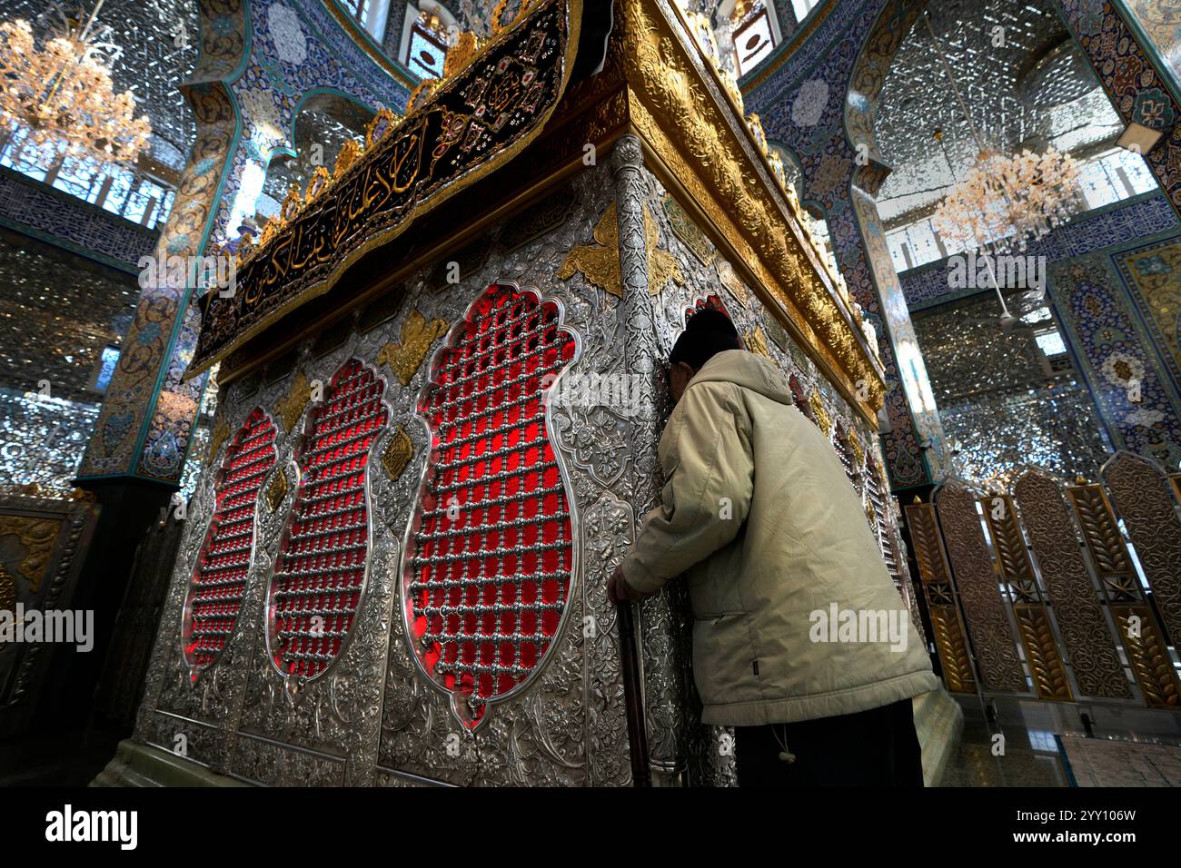 A Syrian man prays at the shrine of al-Sayydah Zeinab, the grand ...