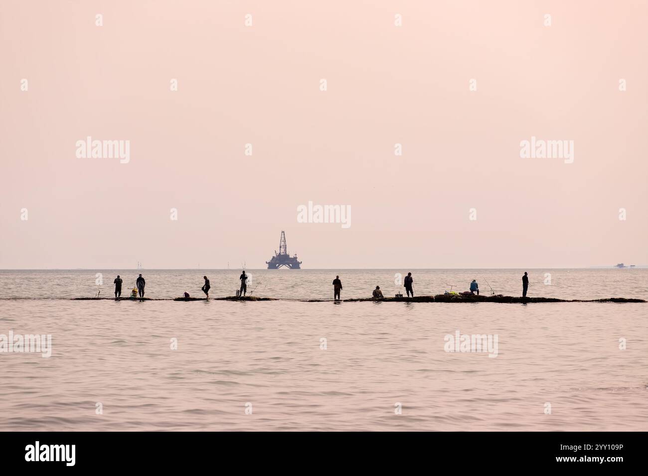 Fishermen from the ridge catch fish in the Caspian Sea. Baku ...