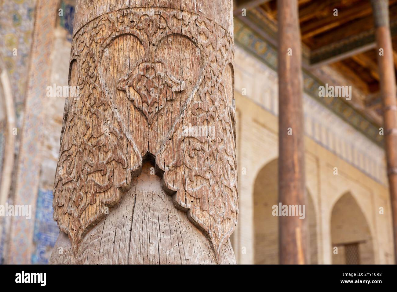 Ancient carved wooden pillar. Bolo Haouz Mosque exterior details, it is ...