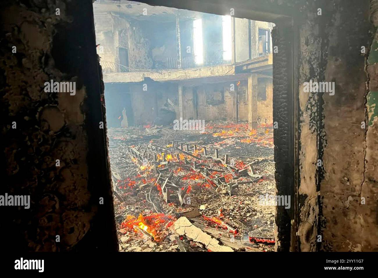 The burnt parliament building in Monrovia, Liberia, Wednesday, Dec 18 ...