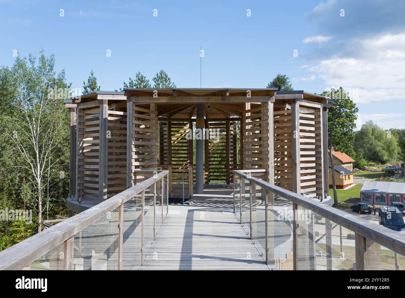 Wooden design building with glass railings and clear blue sky, modern ...