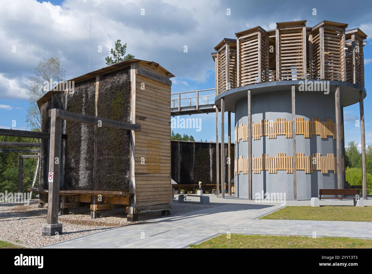 Modern wooden construction with round tower and evaporating walls ...