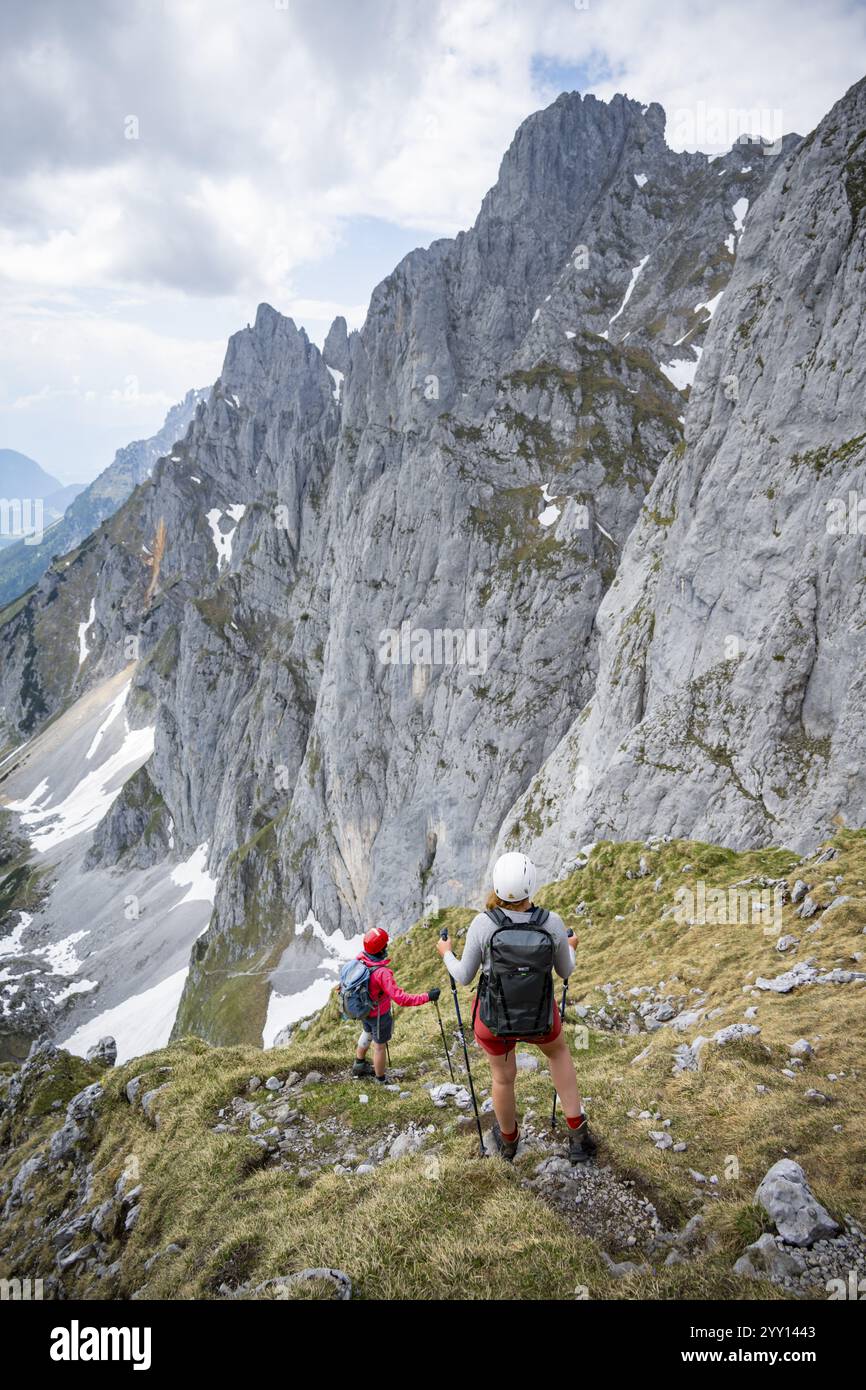 Mountaineer with helmet on a hiking trail, Wilder Kaiser, Kaiser ...