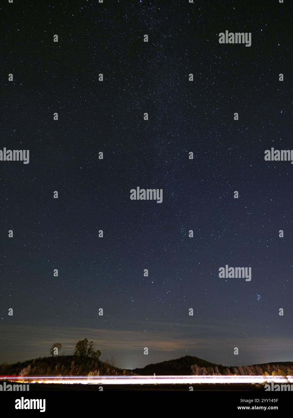 Milky Way stars, shining above the A44 motorway at night, the traffic ...