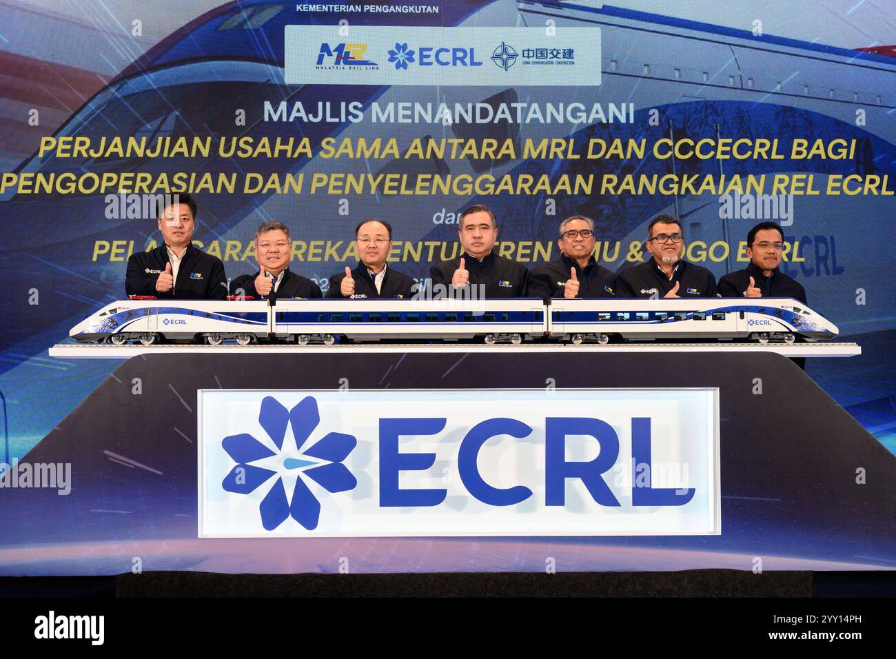 Putrajaya, Malaysia. 18th Dec, 2024. Malaysian Transport Minister Anthony Loke Siew Fook (C) and ...