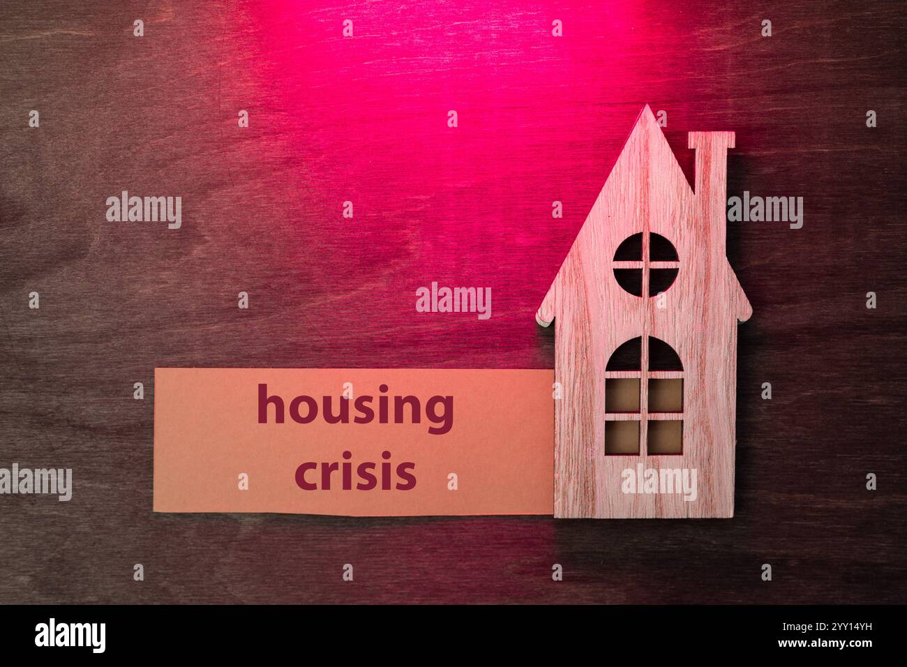 wooden representation of a house with red warning light and a card ...