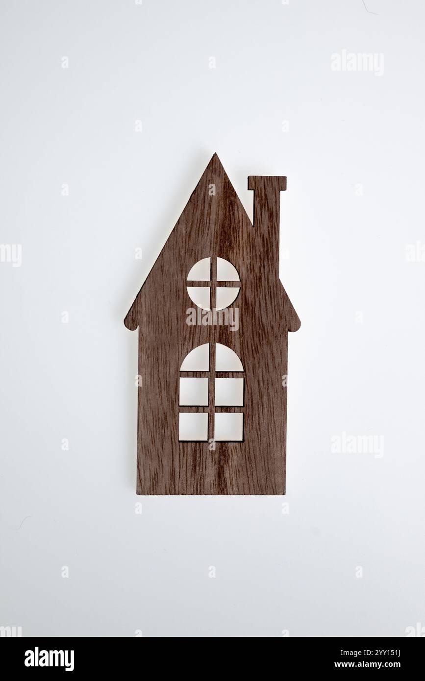 a wooden cut out of a classic house isolated on white background Stock ...