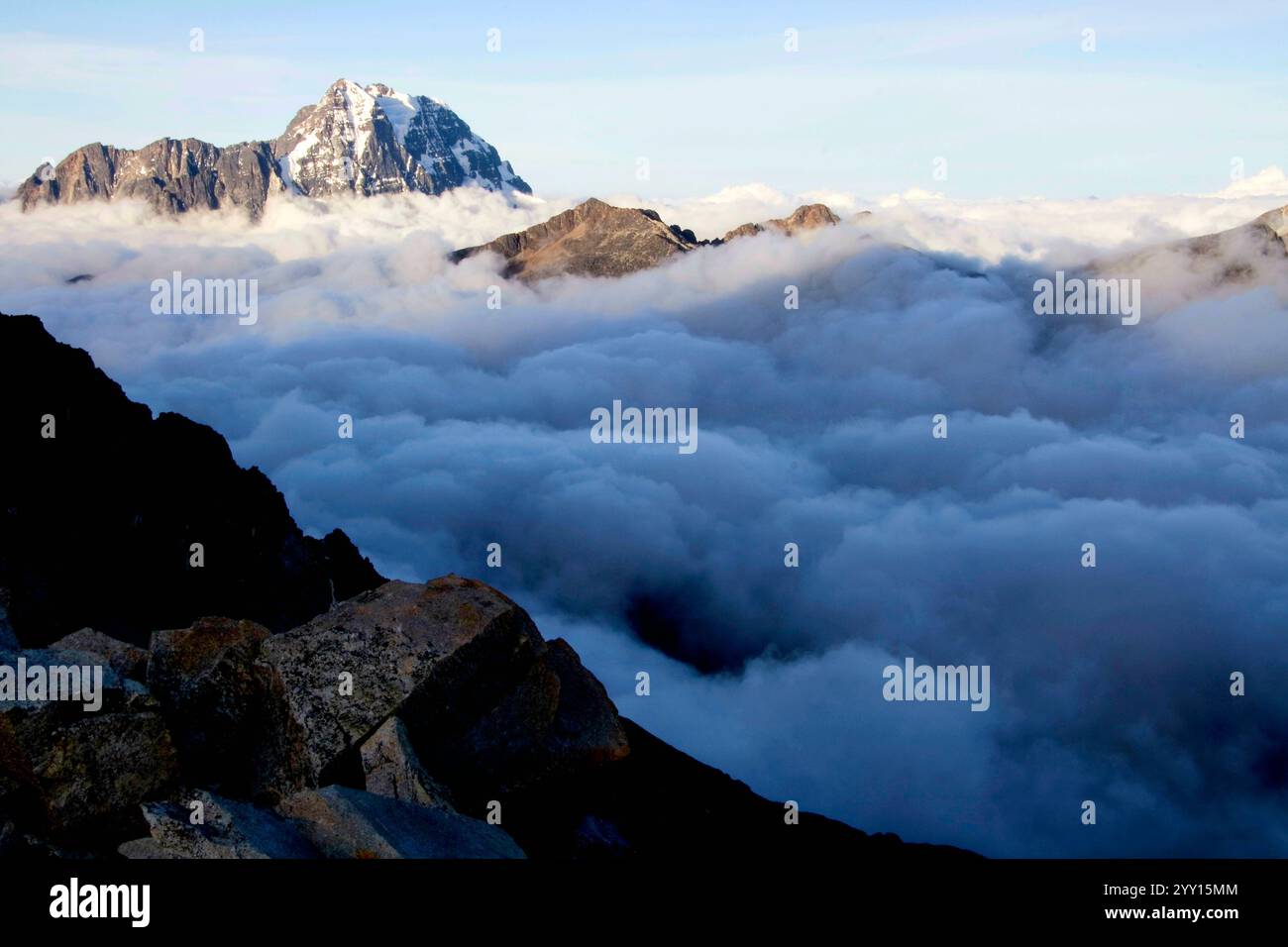 A breathtaking view from Huayna Potosí in Bolivia, showcasing a majestic snow-capped mountain ...