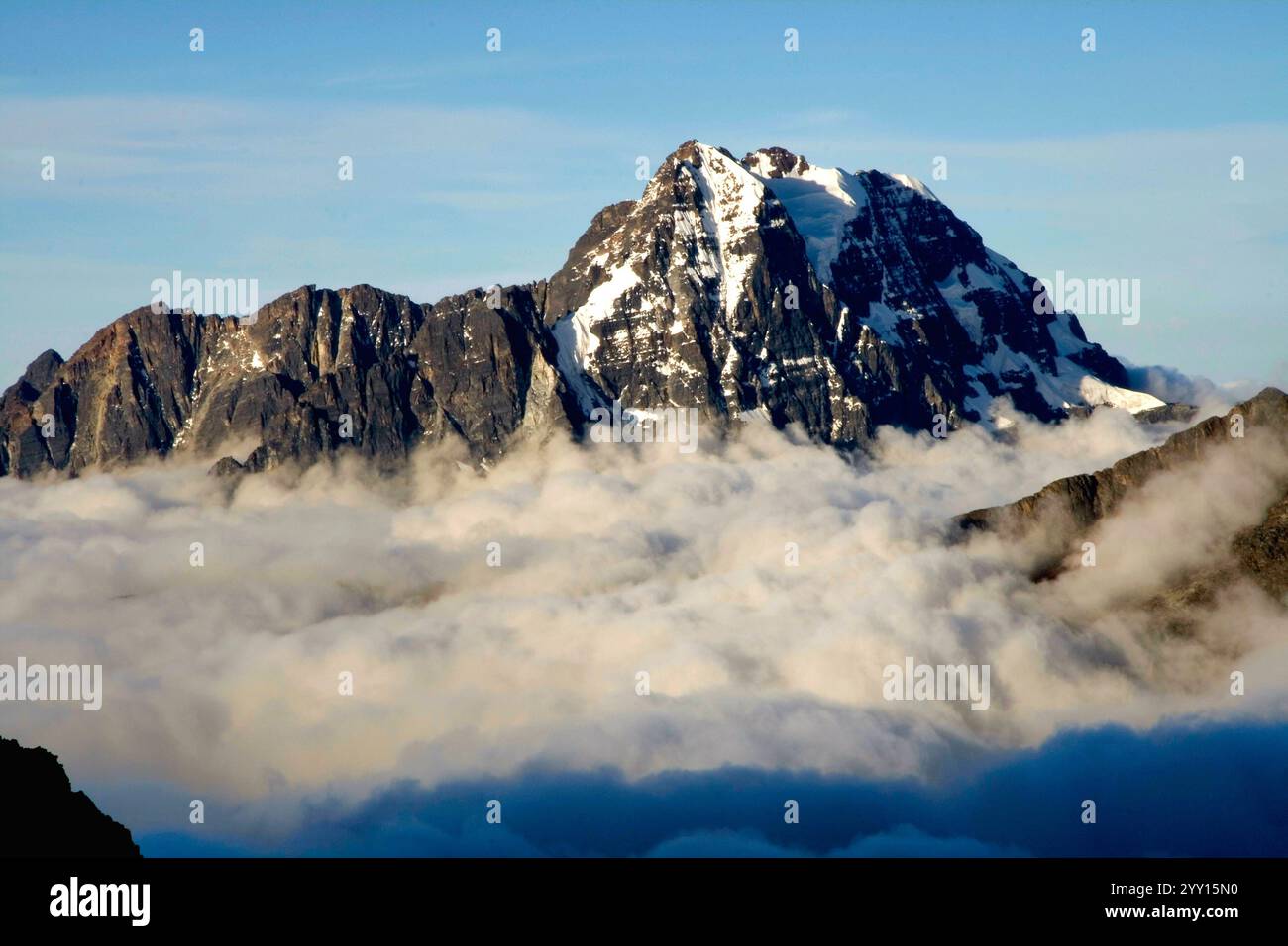 A breathtaking view from Huayna Potosí in Bolivia, showcasing a majestic snow-capped mountain ...