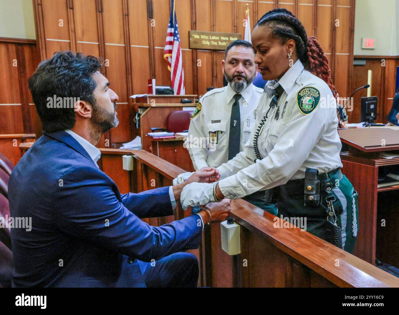 Ohad Fisherman is handcuffed by corrections officer L. Civil after ...