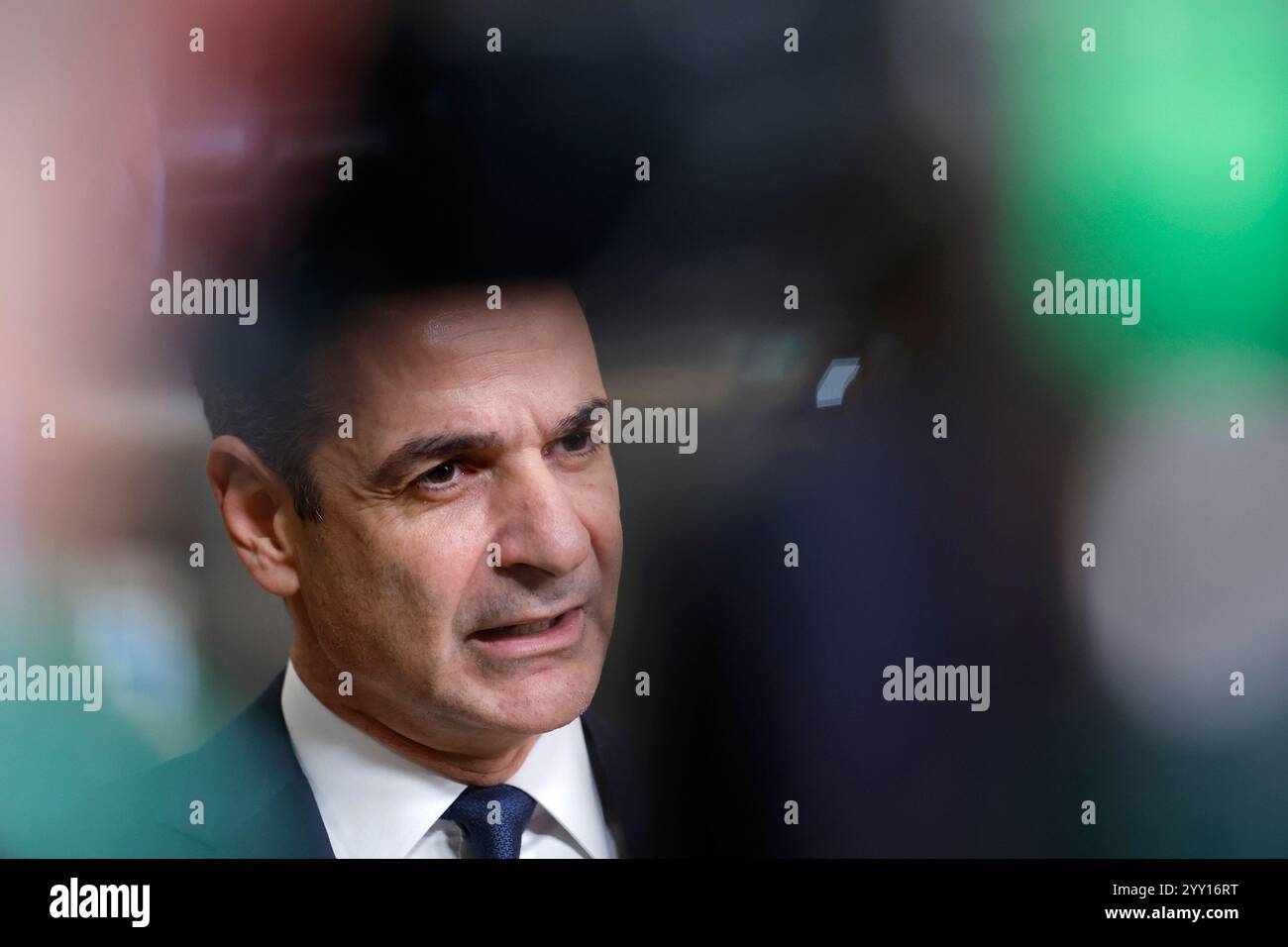 Greece's Prime Minister Kyriakos Mitsotakis speaks with the media as he ...