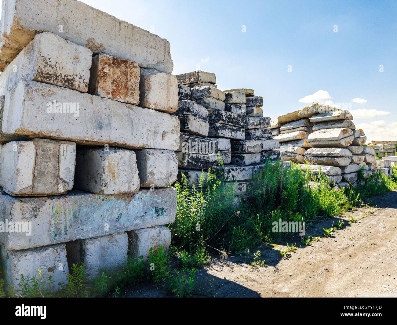 Concrete blocks are stacked in an organized manner within a ...