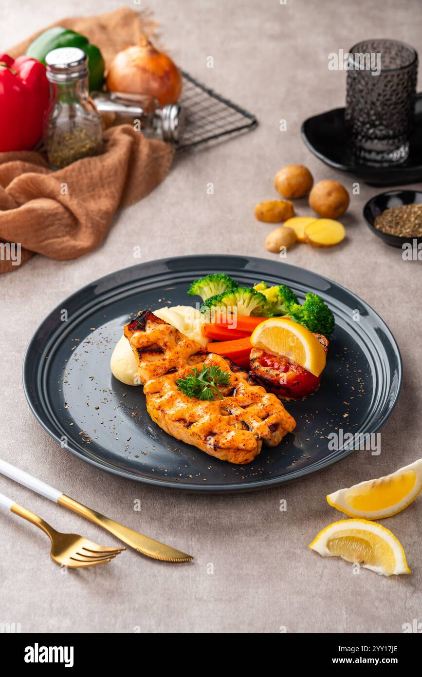 Grilled salmon fillets with mentai sauce and mash potato plating on ...