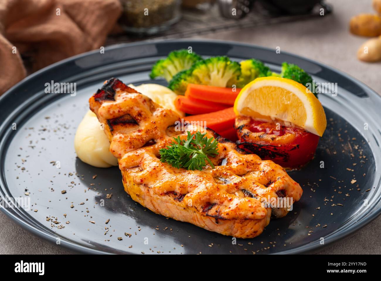 Grilled salmon fillets with mentai sauce and mash potato plating on ...