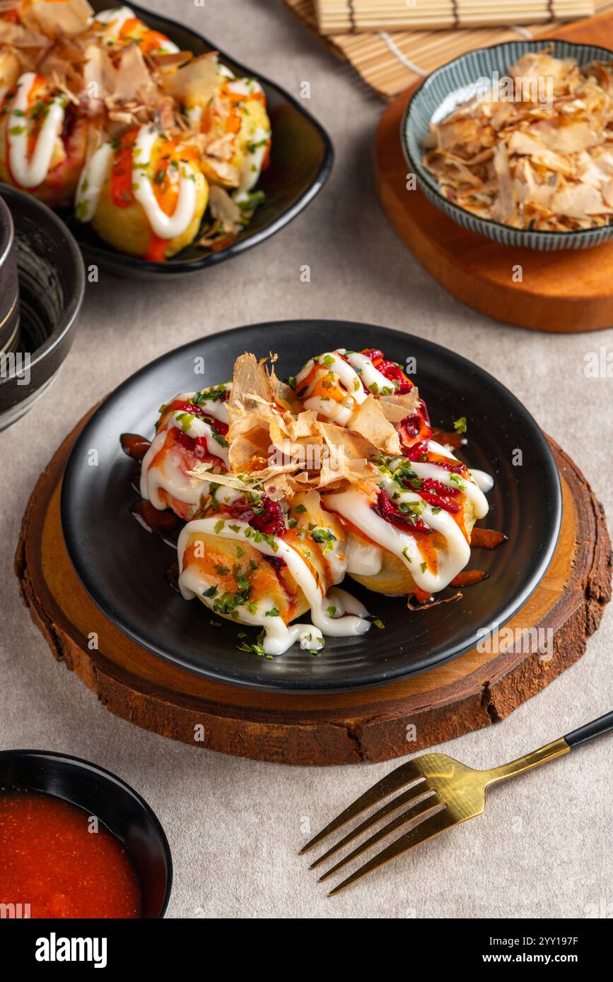 Takoyaki is a ball-shaped Japanese snack made of a wheat flour-based ...