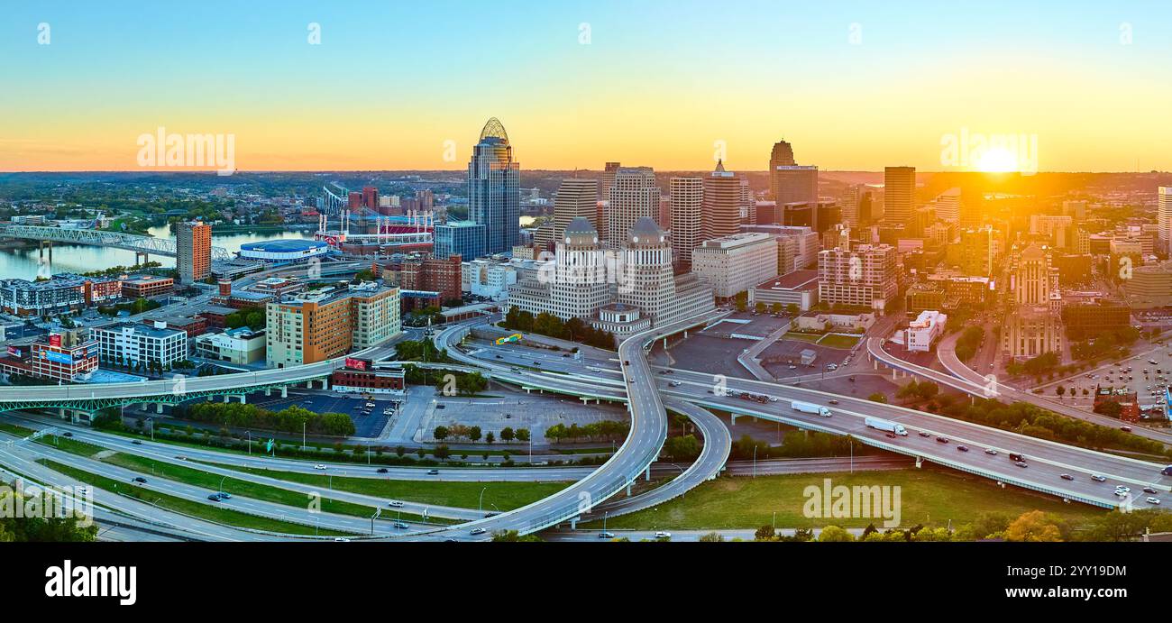 Aerial Cincinnati Skyline at Sunset with Ohio River and Highways Stock ...
