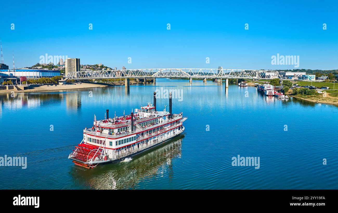 Aerial of paddle wheel Riverboat on Ohio River with Cincinnati Skyline ...