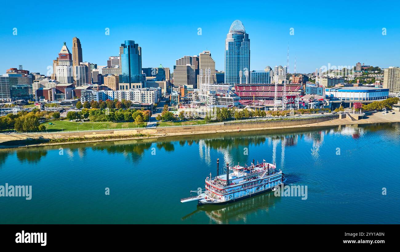 Aerial of Cincinnati Skyline and paddle wheel Riverboat on Ohio River ...