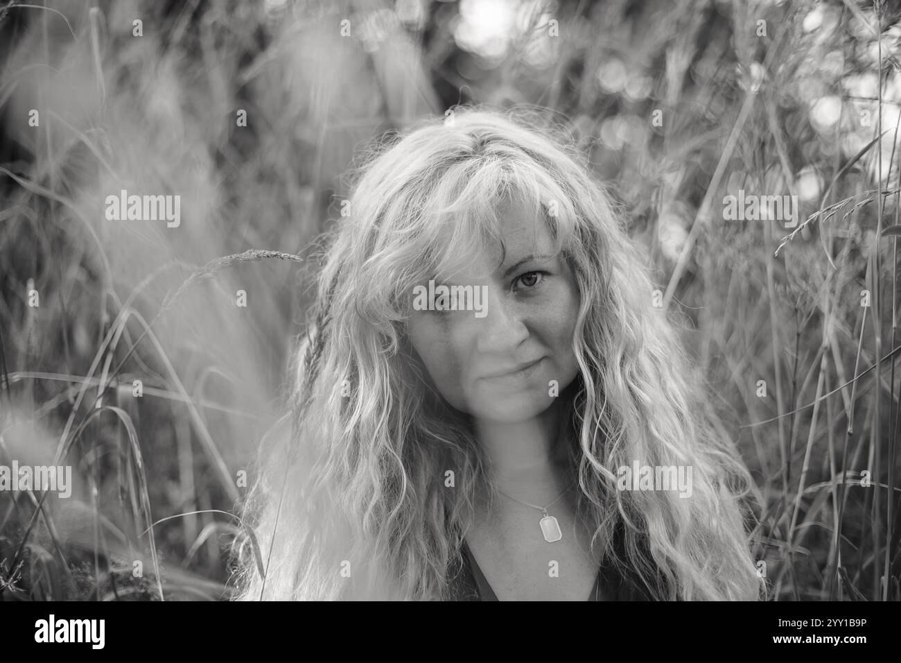 A black-and-white portrait of a woman with Slavic features and straw ...