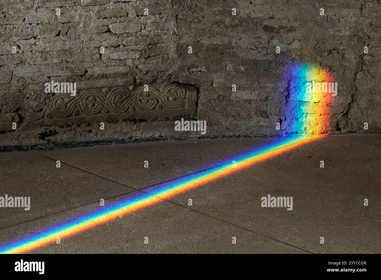 The Natural Light refraction in Rainbow inside ancient stone building ...