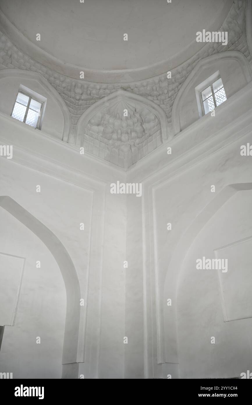 An inside view of the dome with patterns, windows and openwork arches ...