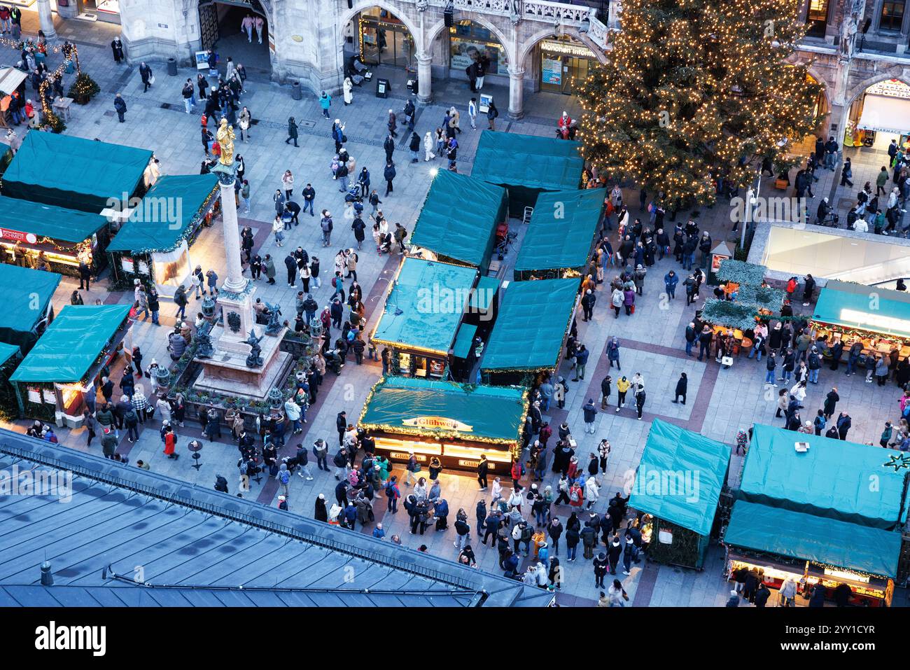 Lively Christmas market at Munich's Marienplatz with decorated ...